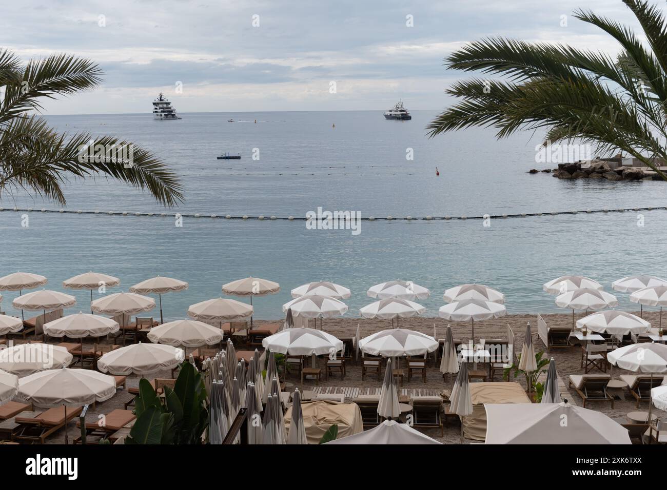 Sandy beach in Monaco, Monte-Carlo Lavrotto beach with clear sea water ...