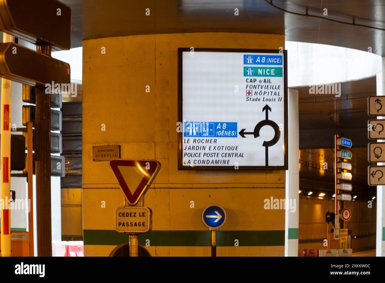 Driving car on narrow streets of Monaco, road signes with directions to ...