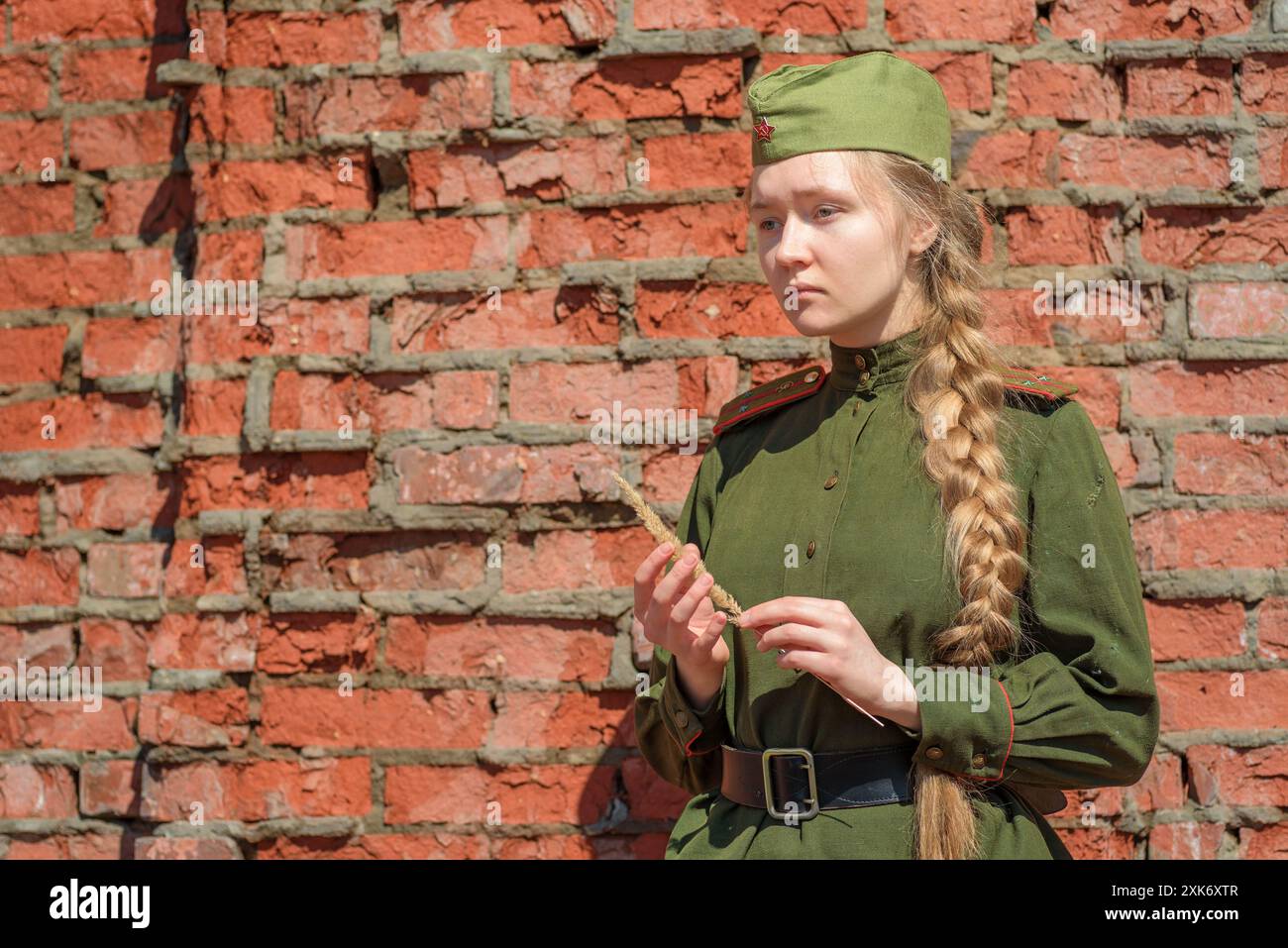 A front-line nurse in the Red Army uniform from World War II mourns ...