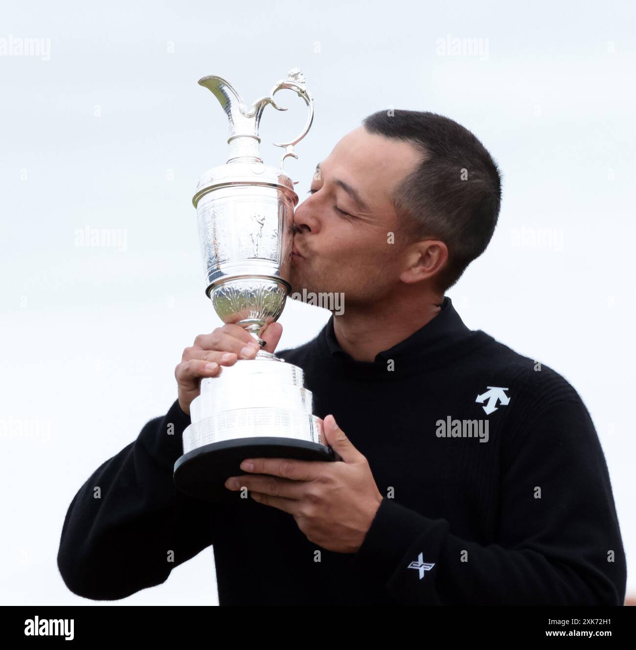 Troon, UK. 21st July, 2024. American Xander Schauffele kisses the Claret jug after winning the ...