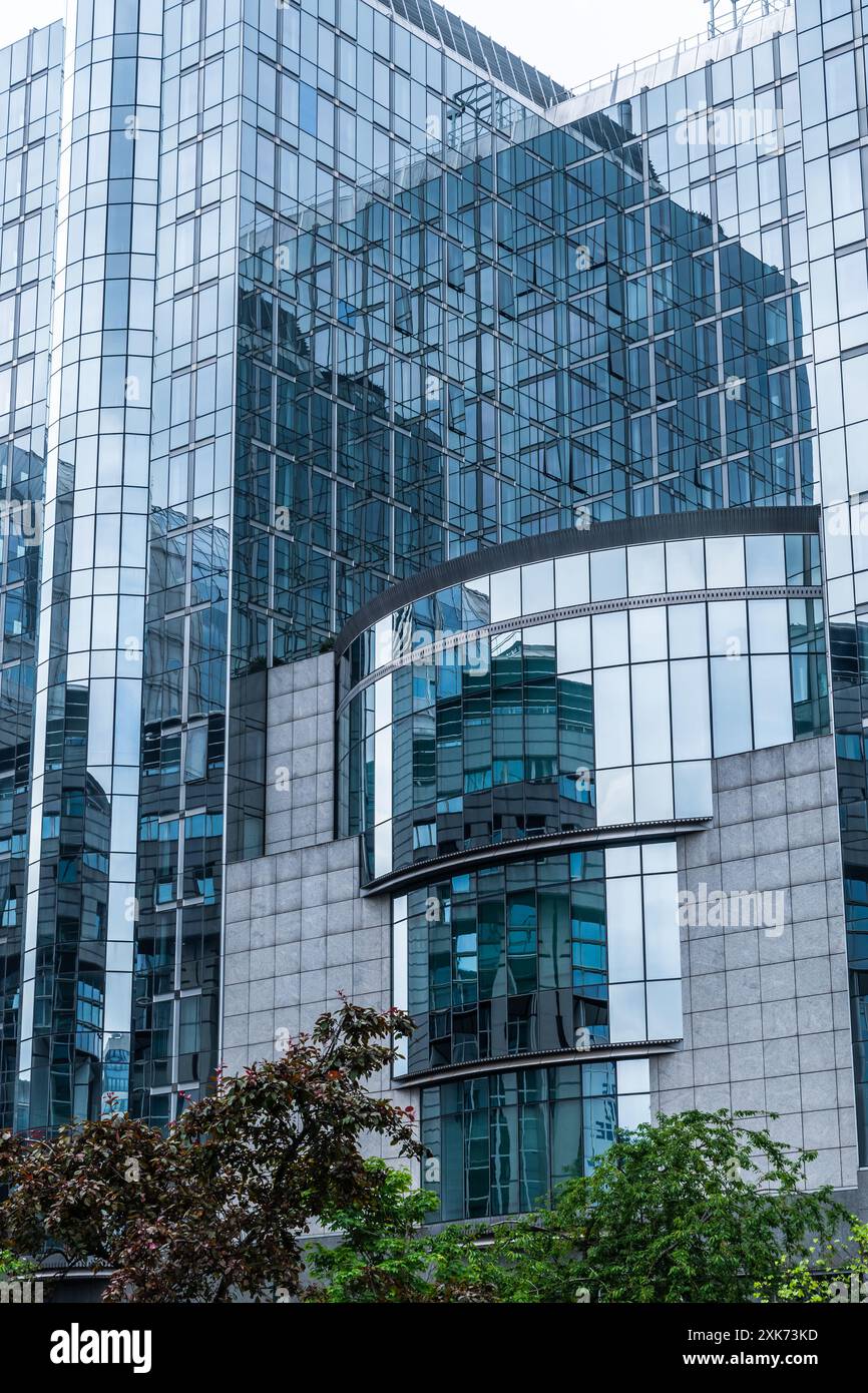 Glass facades of a modern office building in European quarter in ...