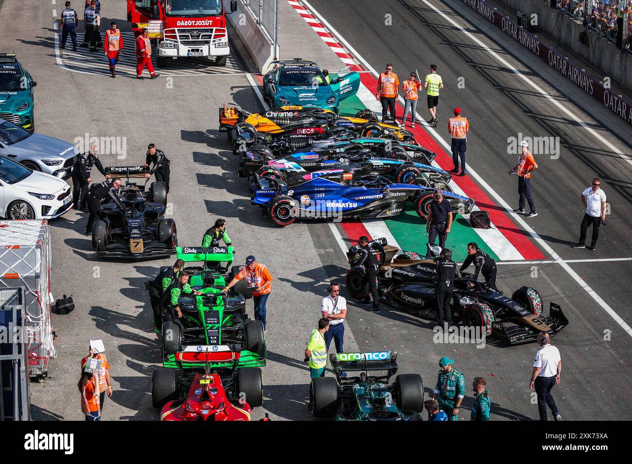 parc ferme with the F1 cars and the 07 and 09 APX GP Modified F2 car prepared by Mercedes ...