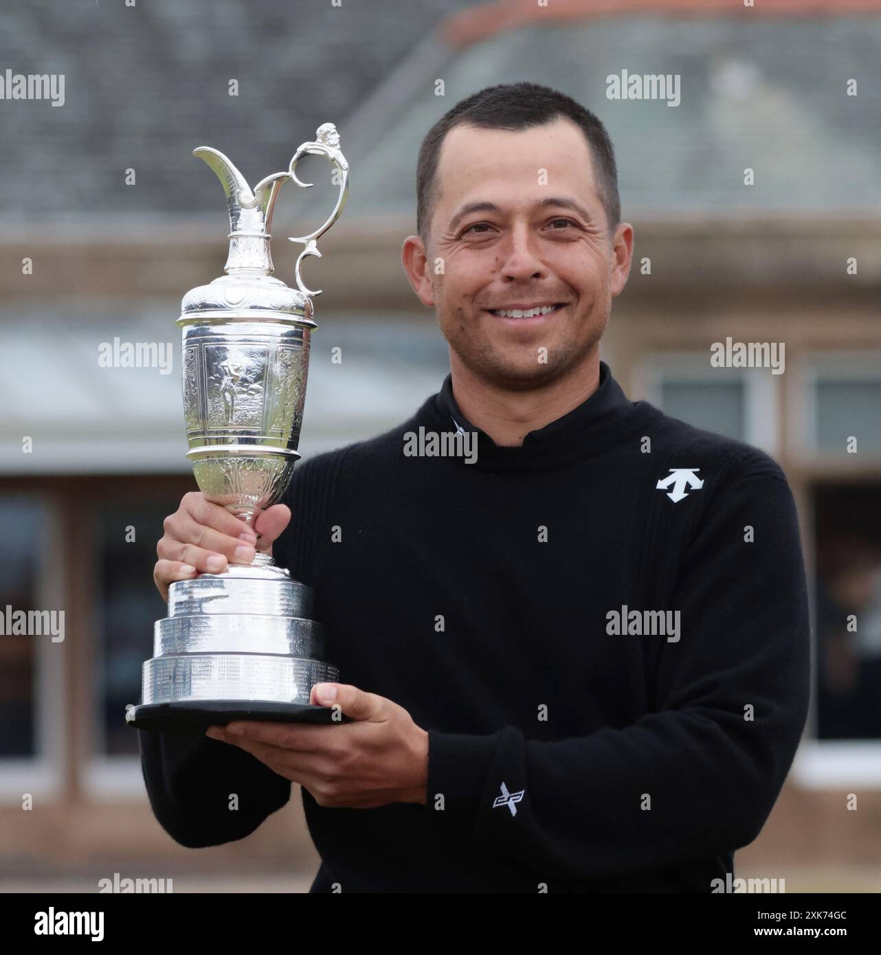 Troon, UK. 21st July, 2024. American Xander Schauffele kisses the Claret jug after winning the ...