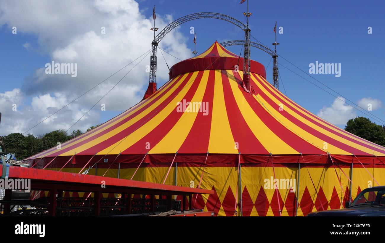Bridgend, Wales - July 7 2024: A large, brightly coloured circus big ...