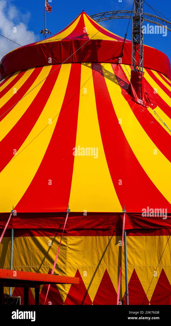 Bridgend, Wales - July 7 2024: A large, brightly coloured circus big ...
