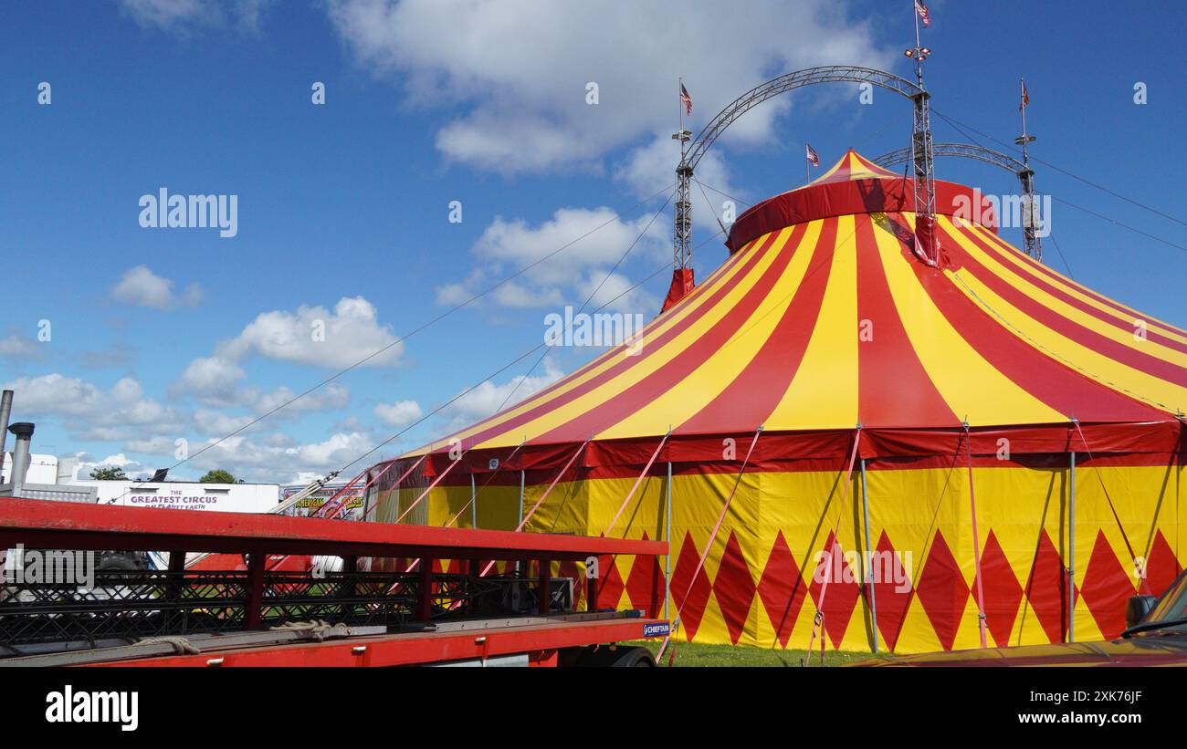 Bridgend, Wales - July 7 2024: A large, brightly coloured circus big ...