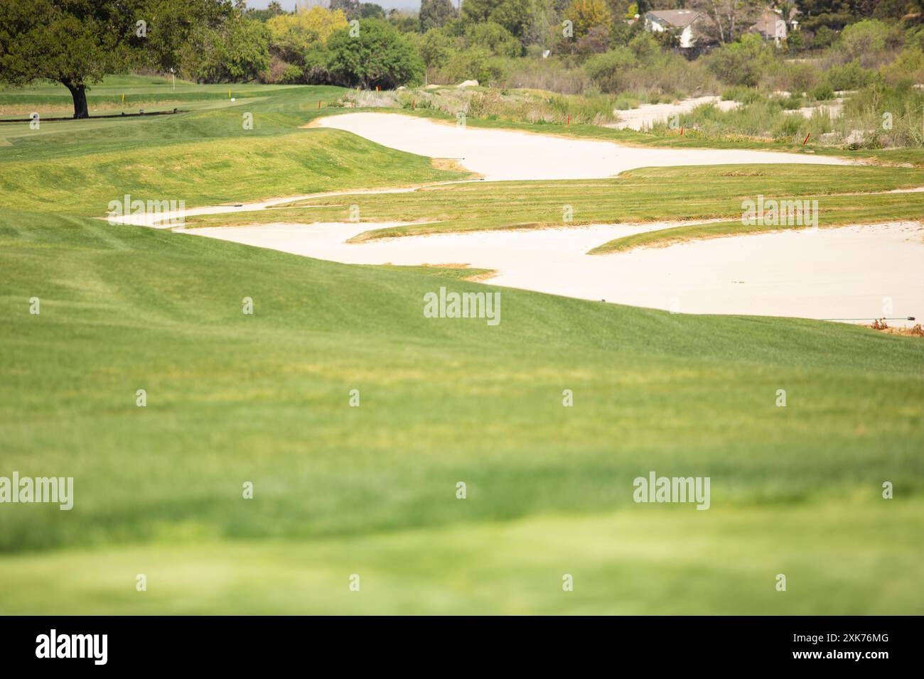 A view looking down a golf course, feating sand traps Stock Photo - Alamy