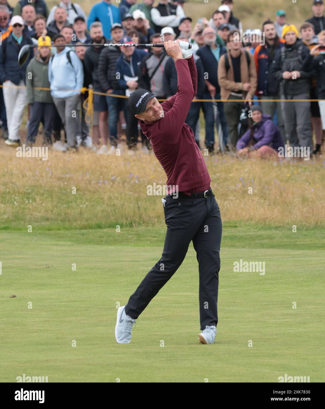 Troon, UK. 21st July, 2024. Justin Rose hits an iron.on the 16th fairway at the 152nd Open ...