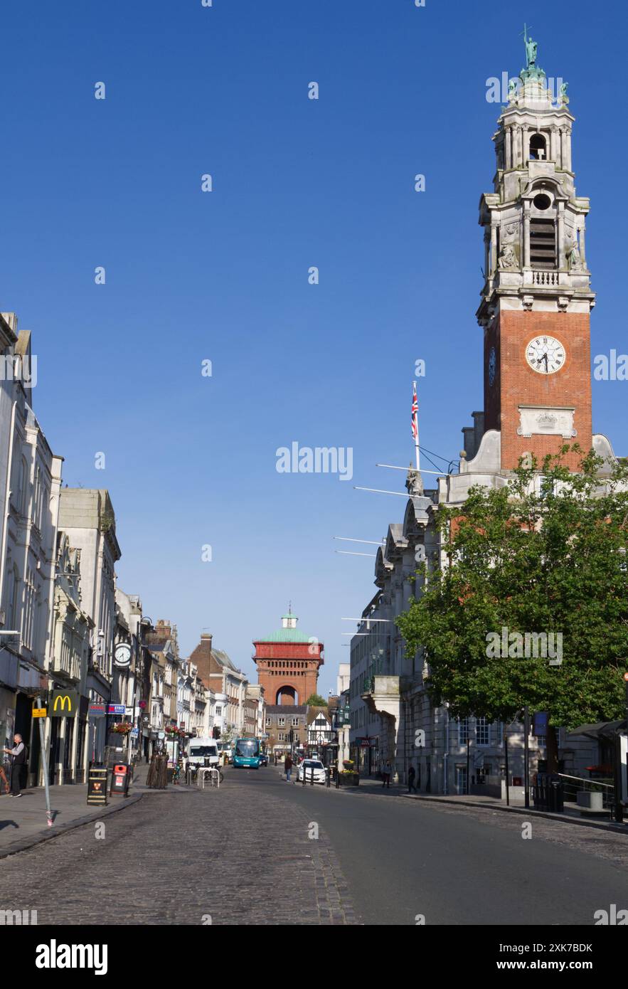 View down High Street in Colchester, Essex. The Town Hall has a tower ...