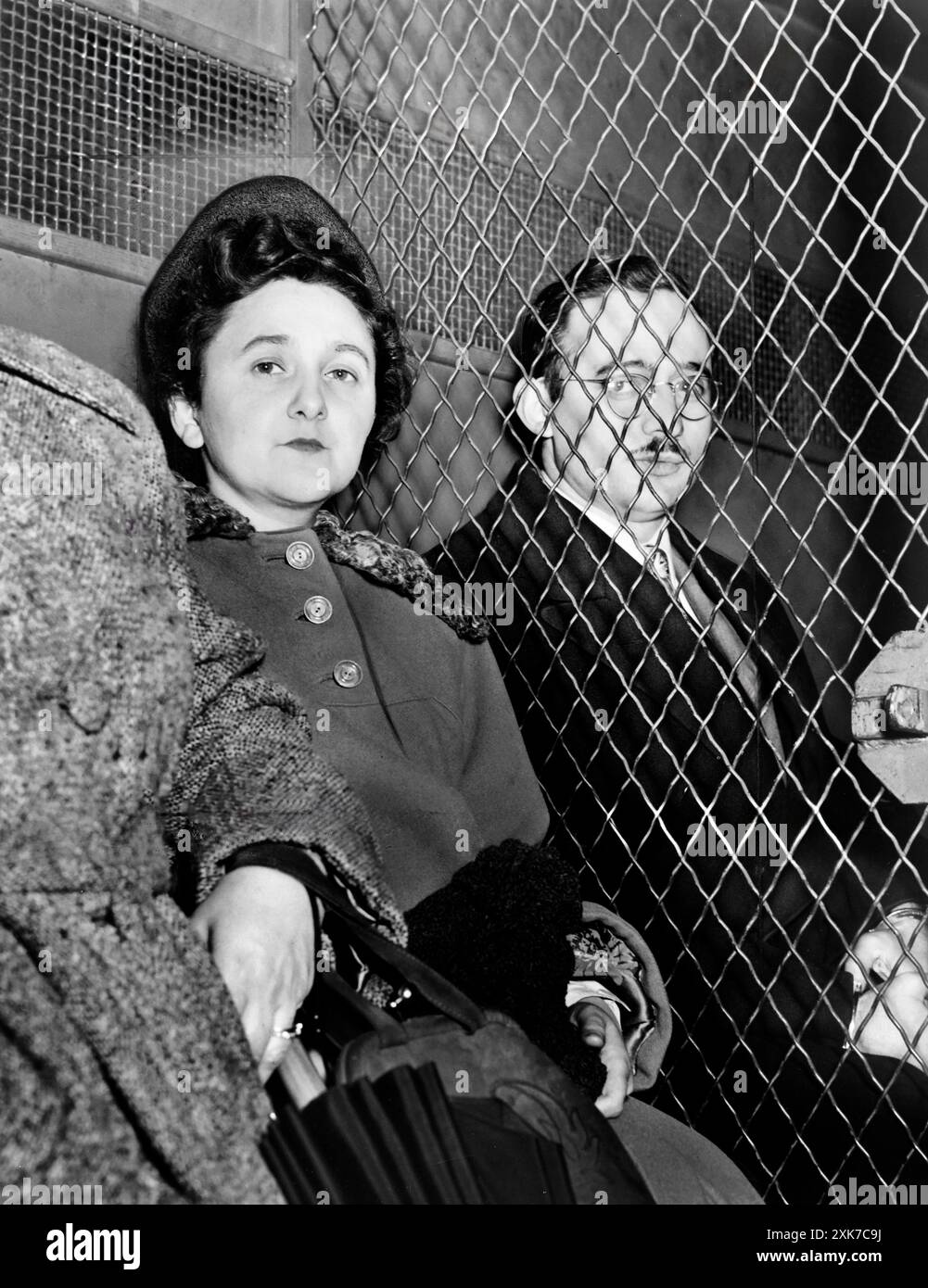 Ethel and Julius Rosenberg, separated by heavy wire screen as they leave U.S. Court House after ...
