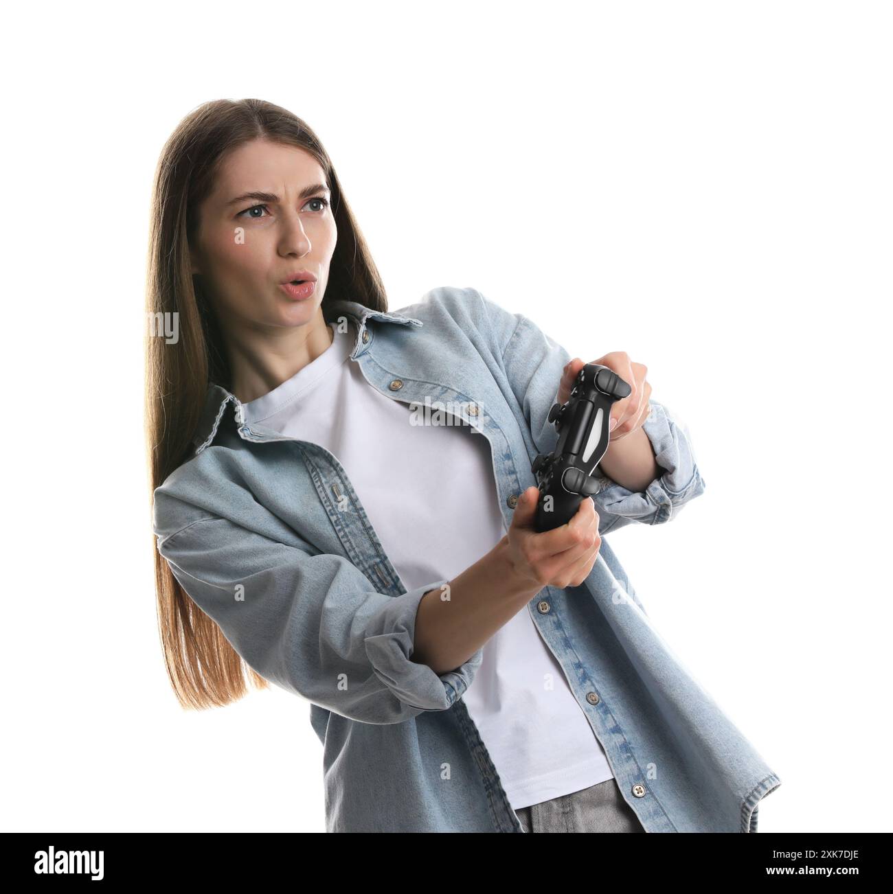 Surprised woman playing video games with controller on white background ...