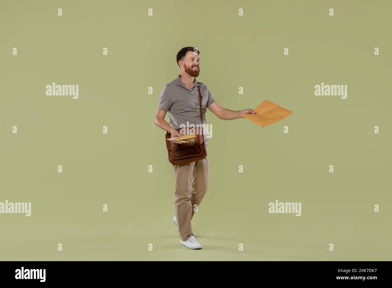 Postman with brown bag delivering letters on light green background ...