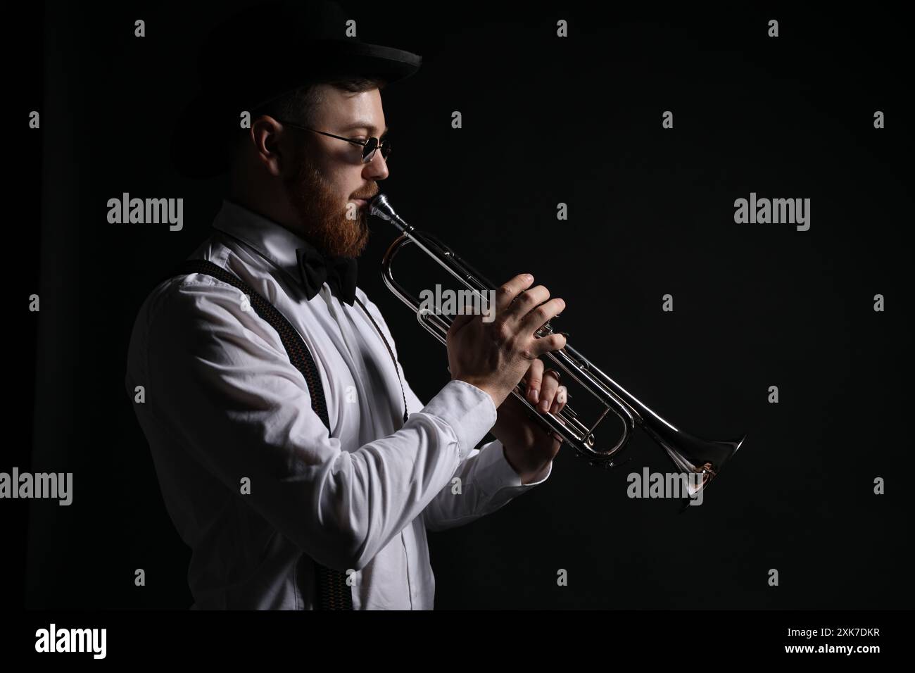 Professional musician playing trumpet on black background Stock Photo ...
