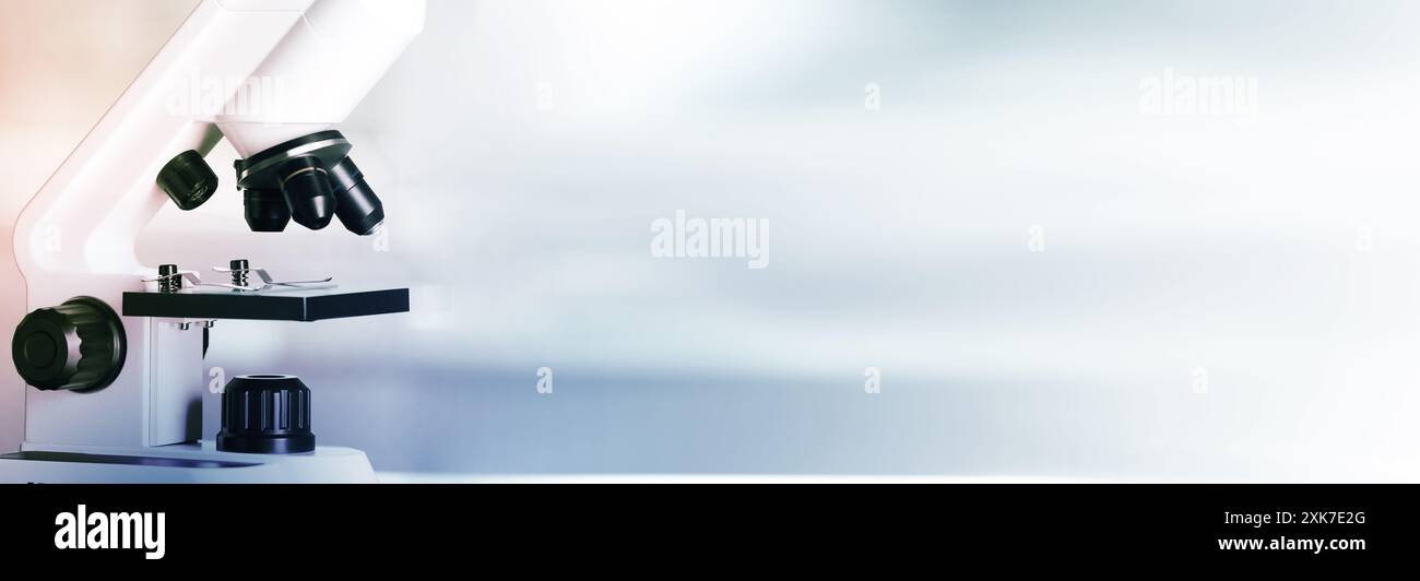 Microscope on blurred background, closeup. Banner design with space for ...