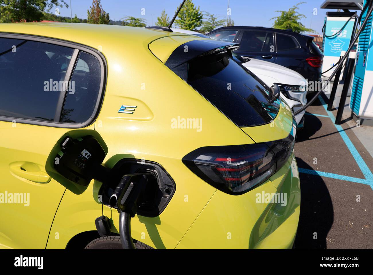 Electric car battery charging in the parking lot of a Carrefour ...