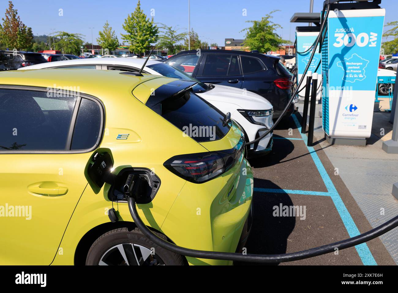 Electric car battery charging in the parking lot of a Carrefour ...