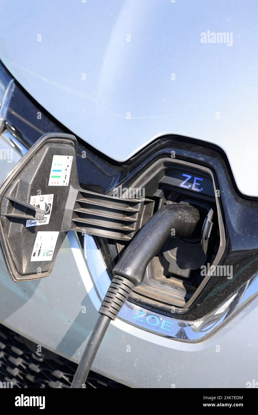 Electric car battery charging in the parking lot of a Carrefour ...