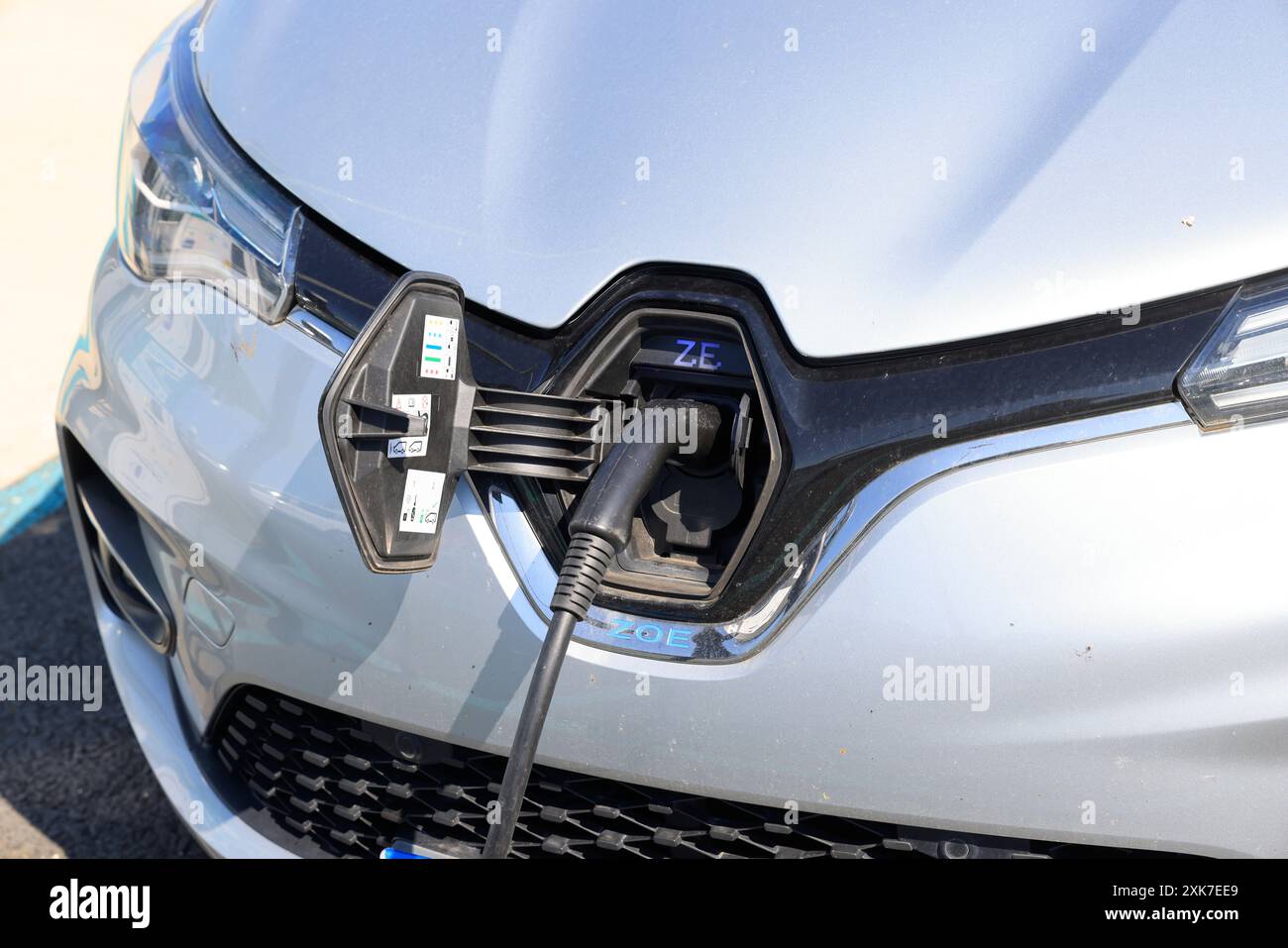 Electric car battery charging in the parking lot of a Carrefour ...