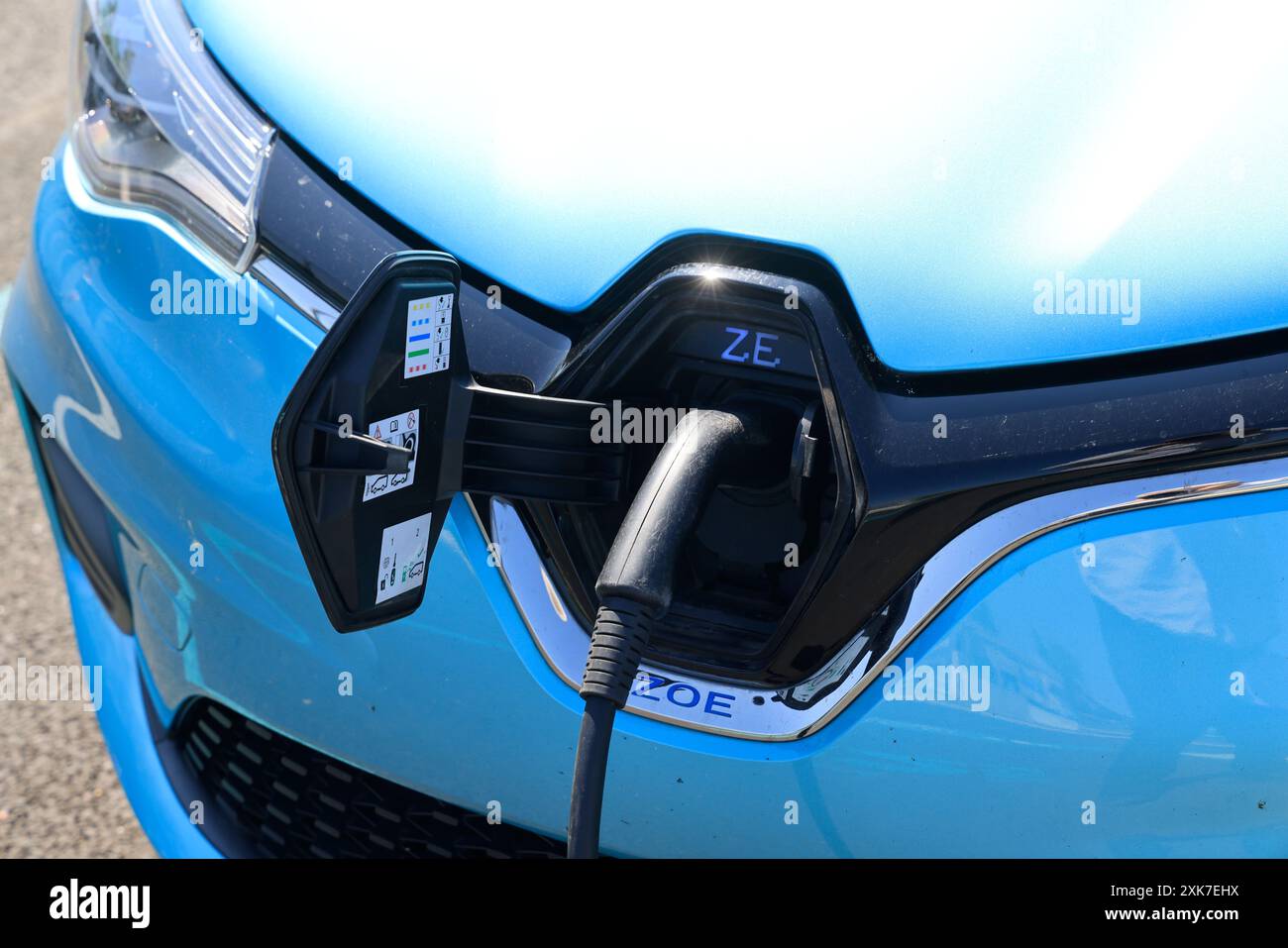 Electric car battery charging in the parking lot of a Carrefour ...