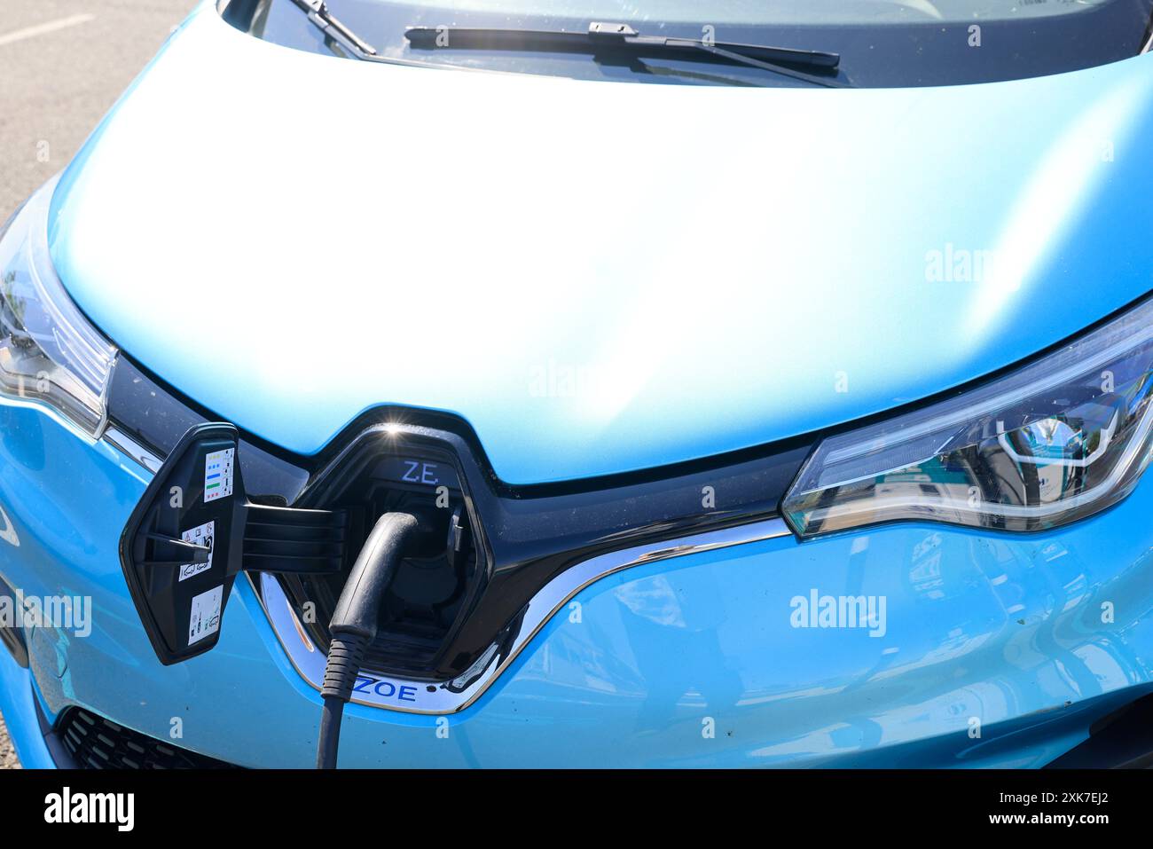 Electric car battery charging in the parking lot of a Carrefour ...