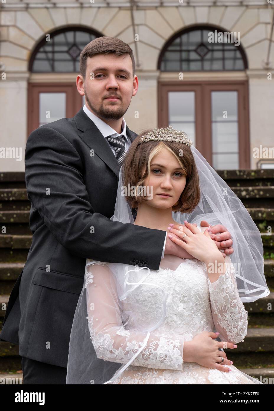Portrait of a young bride and groom on the background of an ancient ...