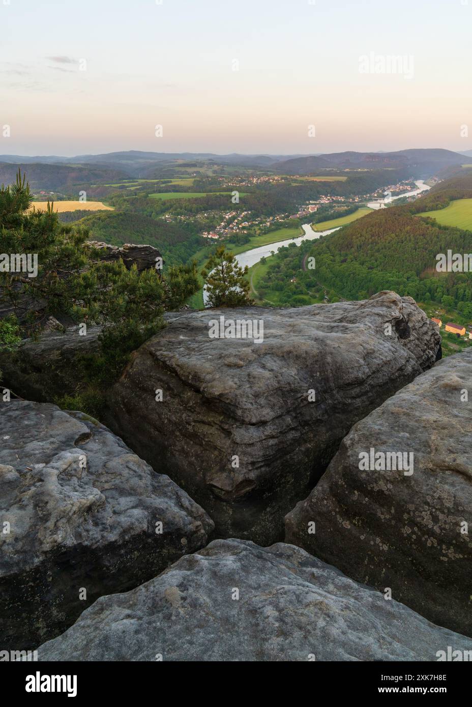 Beautiful view through the rock of a rustic motif with green meadows ...