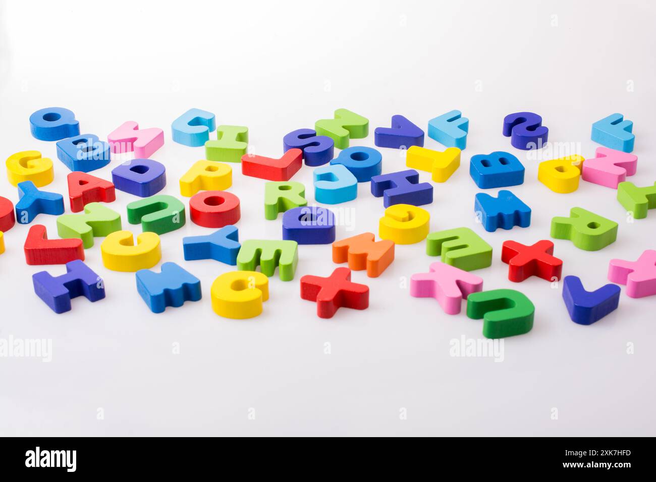 Colorful alphabet letter blocks scattered randomly on white background ...