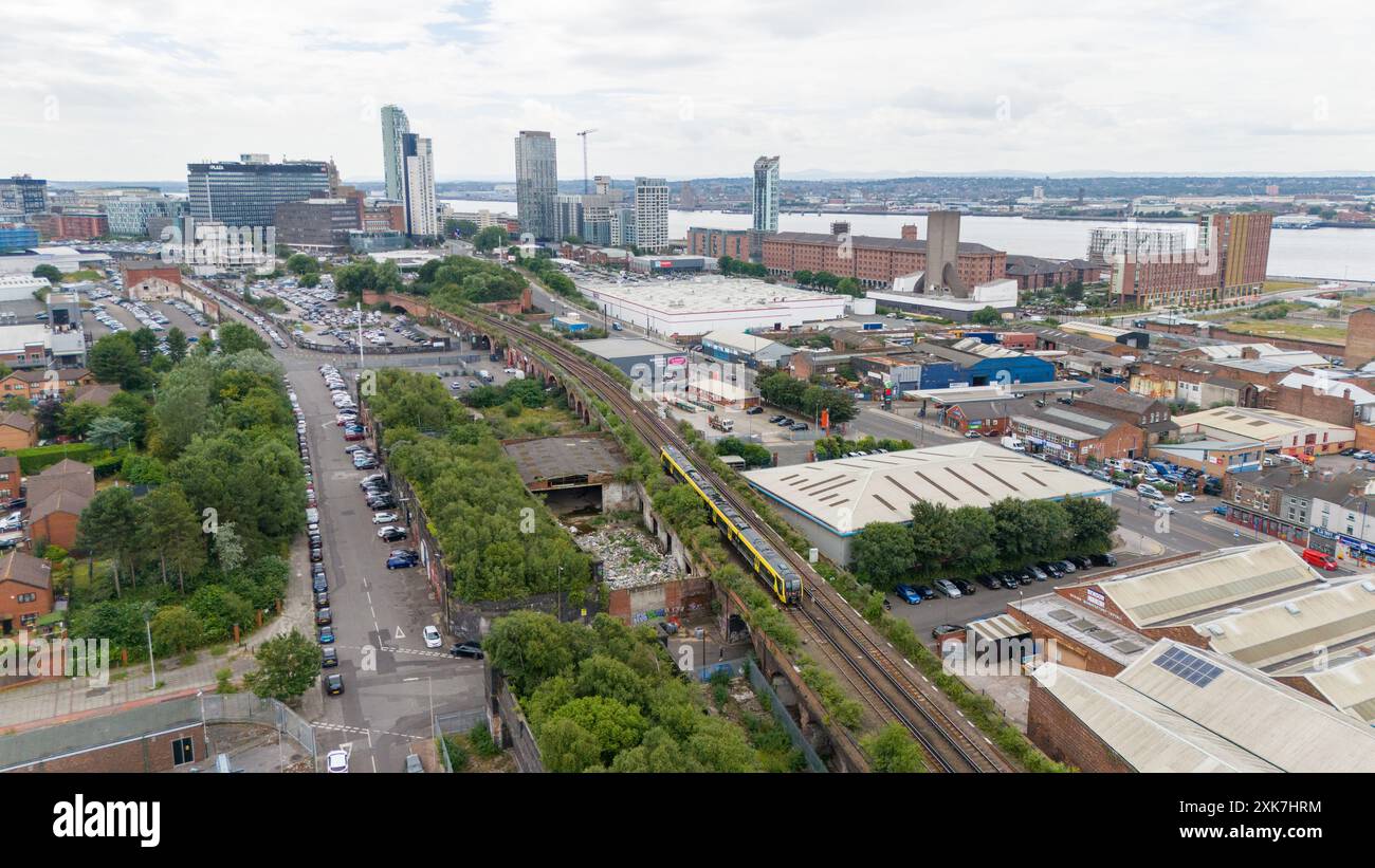 Train leaving liverpool city centre passing the industrial docks area ...