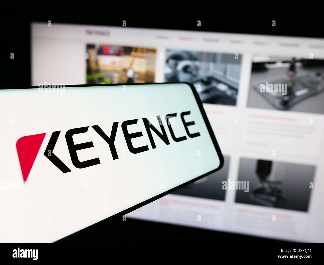 Smartphone with logo of Japanese electronics company Keyence ...