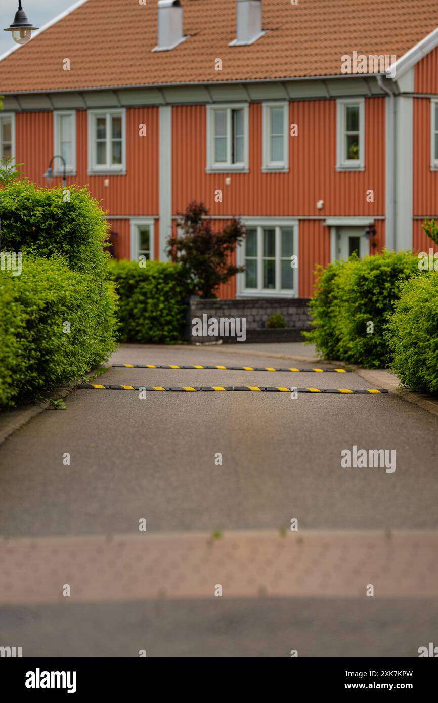 Speed bumps in a narrow street Stock Photo - Alamy