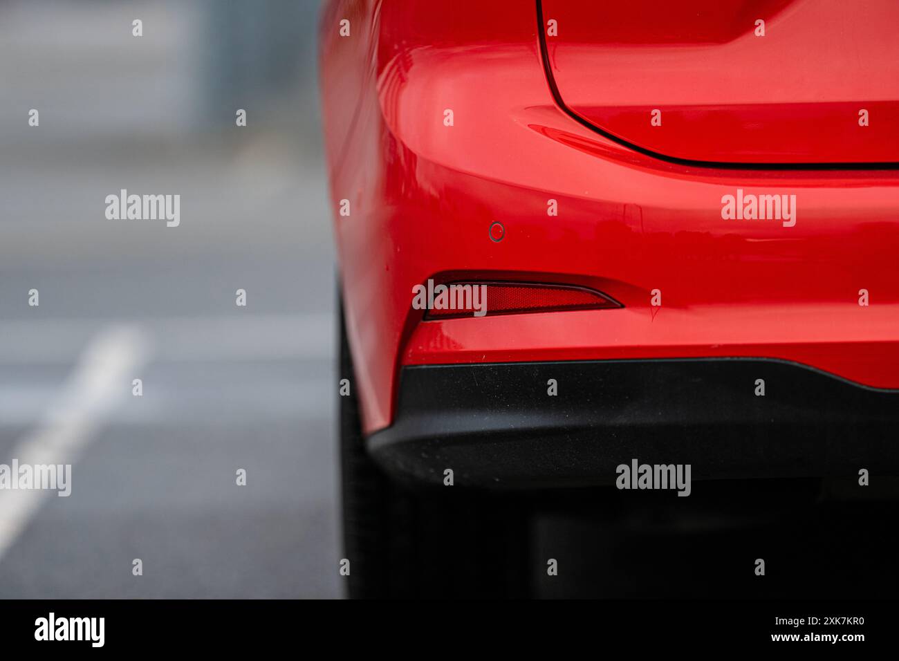 Rear bumper of a red car Stock Photo - Alamy