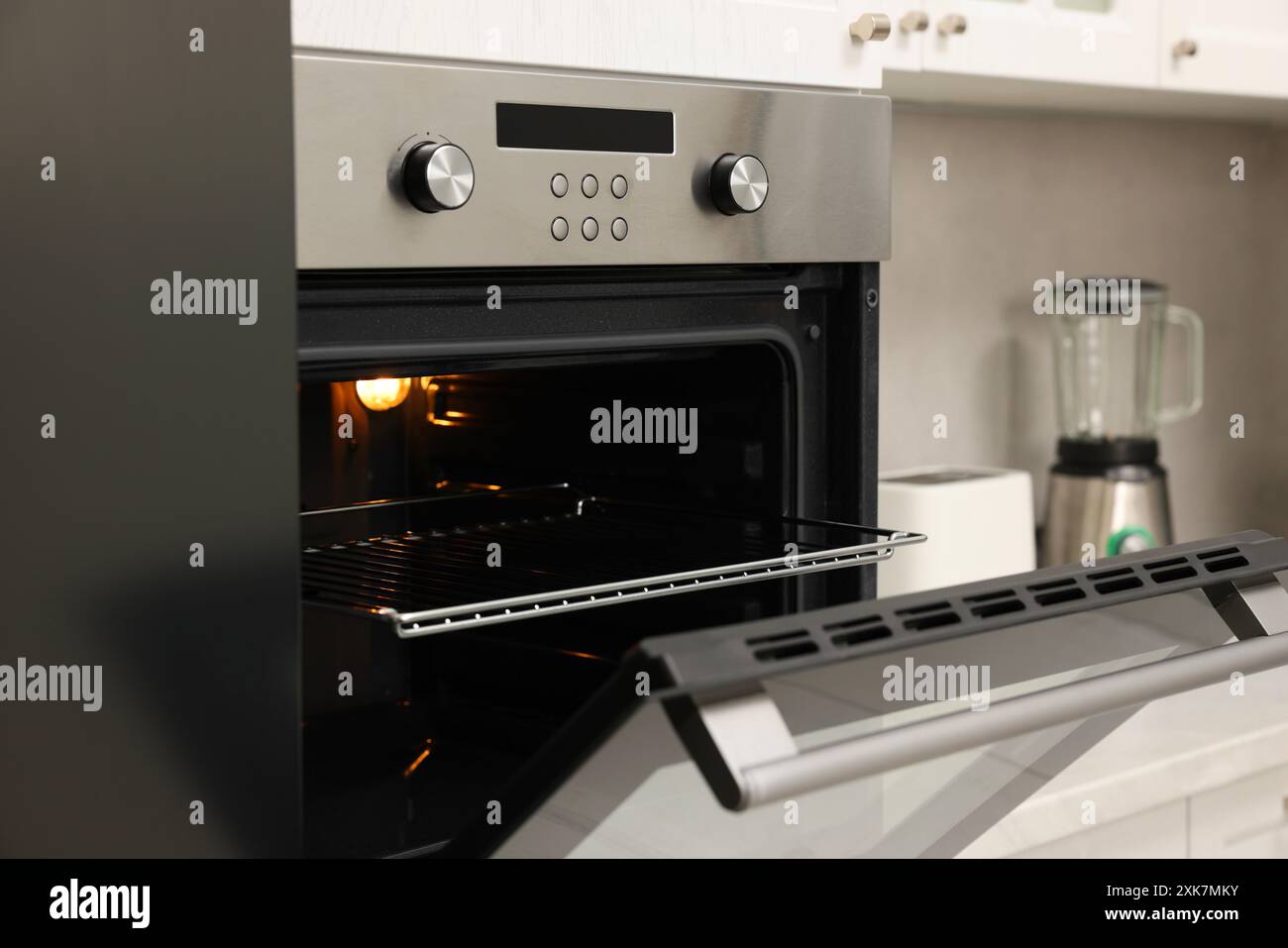 Open electric oven in kitchen. Cooking appliance Stock Photo - Alamy