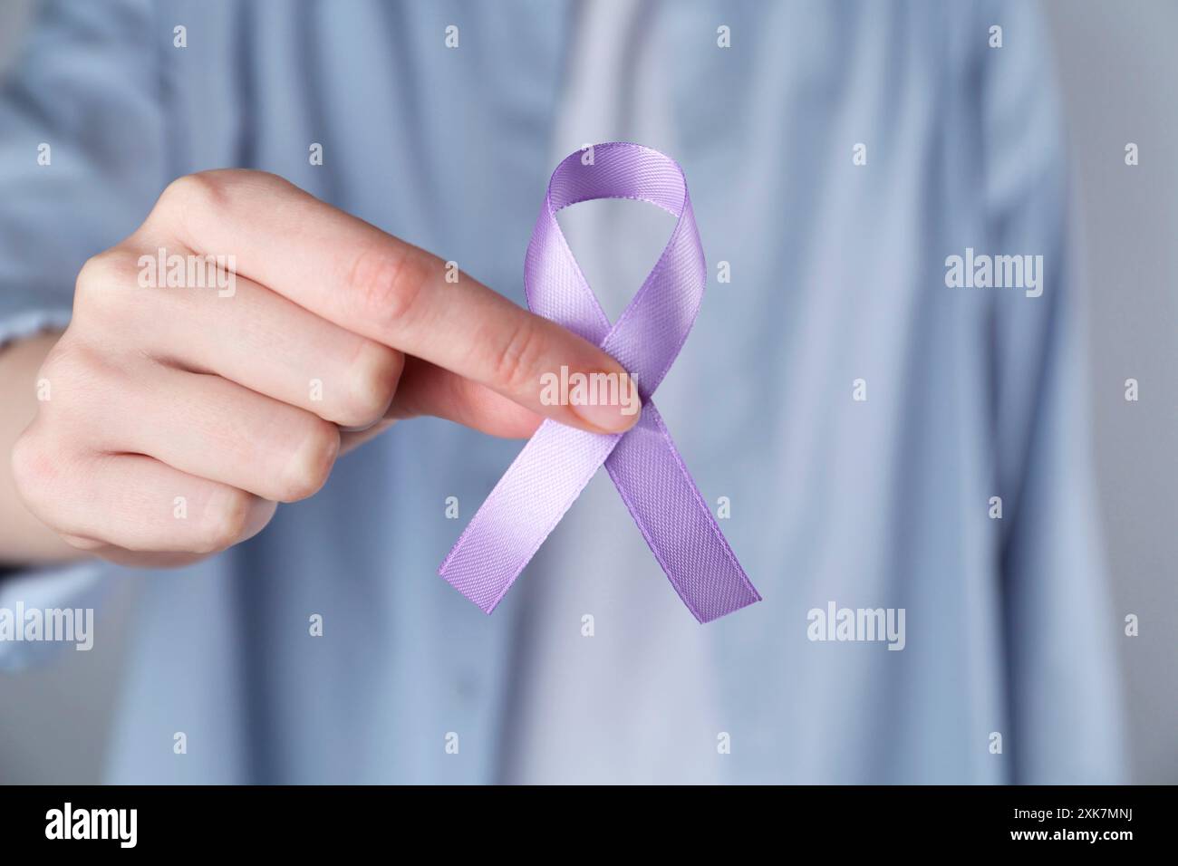 Woman violet awareness ribbon hi-res stock photography and images - Alamy