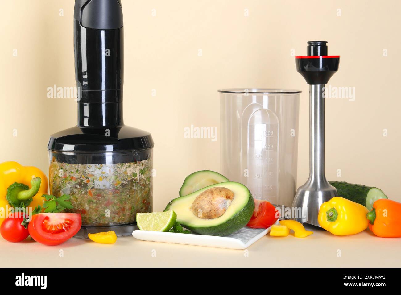 Hand blender kit and fresh products on beige background Stock Photo - Alamy
