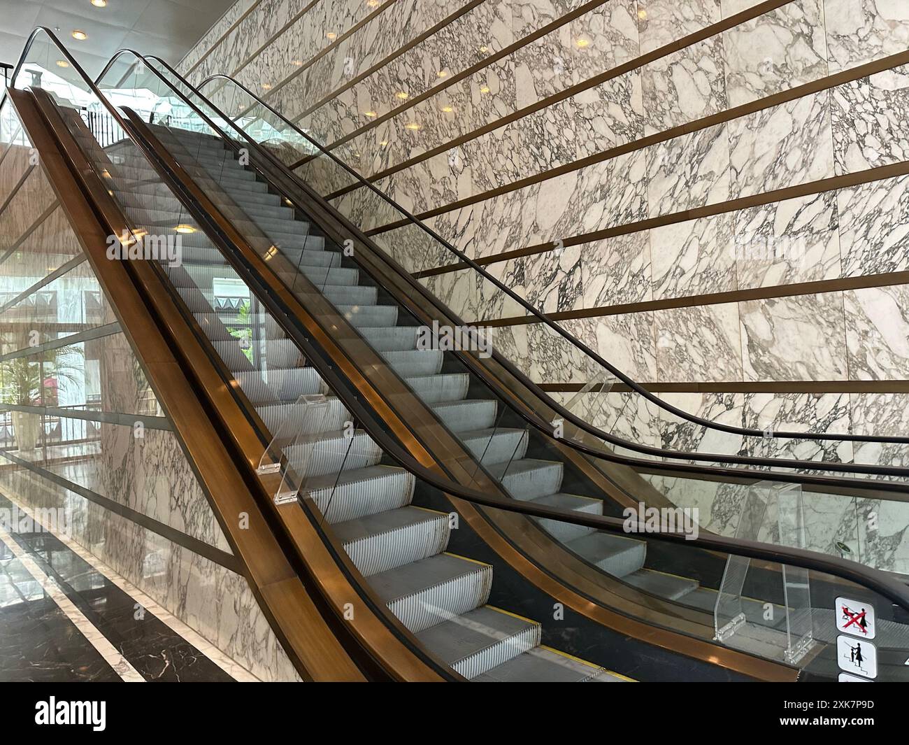 Modern escalators with handrails in shopping mall Stock Photo - Alamy