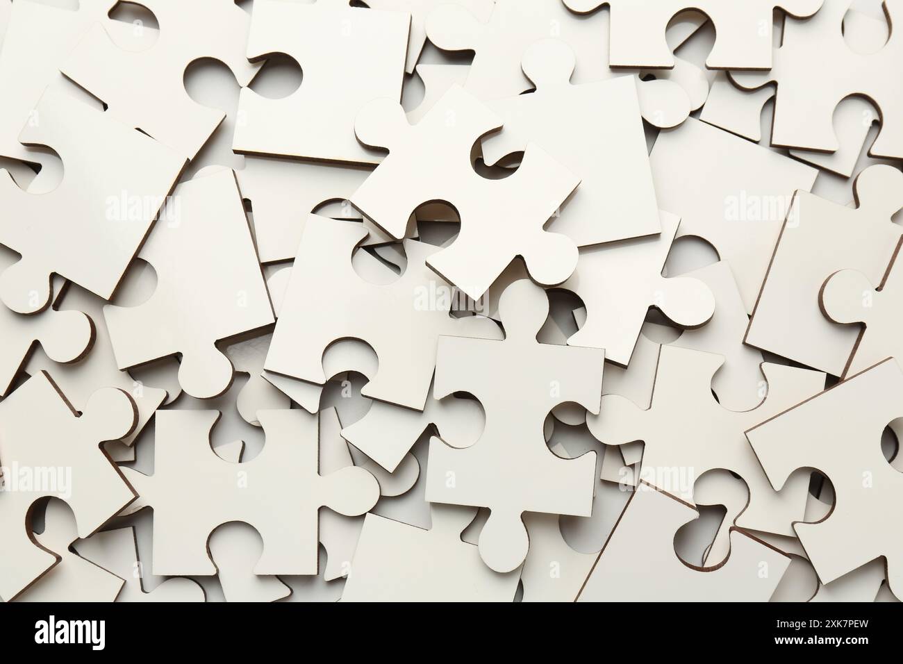 Pile of white puzzle pieces as background, top view Stock Photo - Alamy