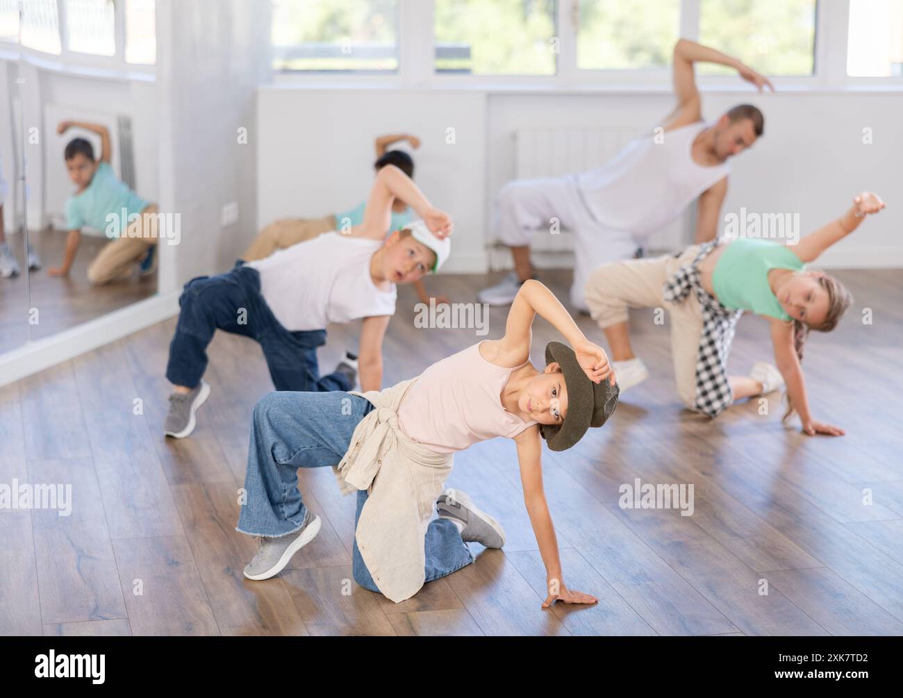 Group of children dancers having break dance training at dance studio ...
