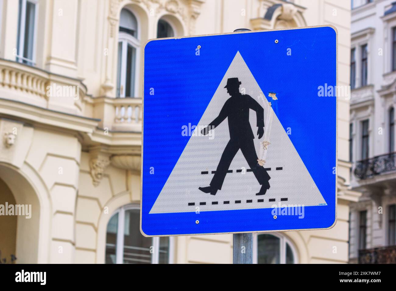 City landscape - view of the pedestrian crossing sign in the historical ...