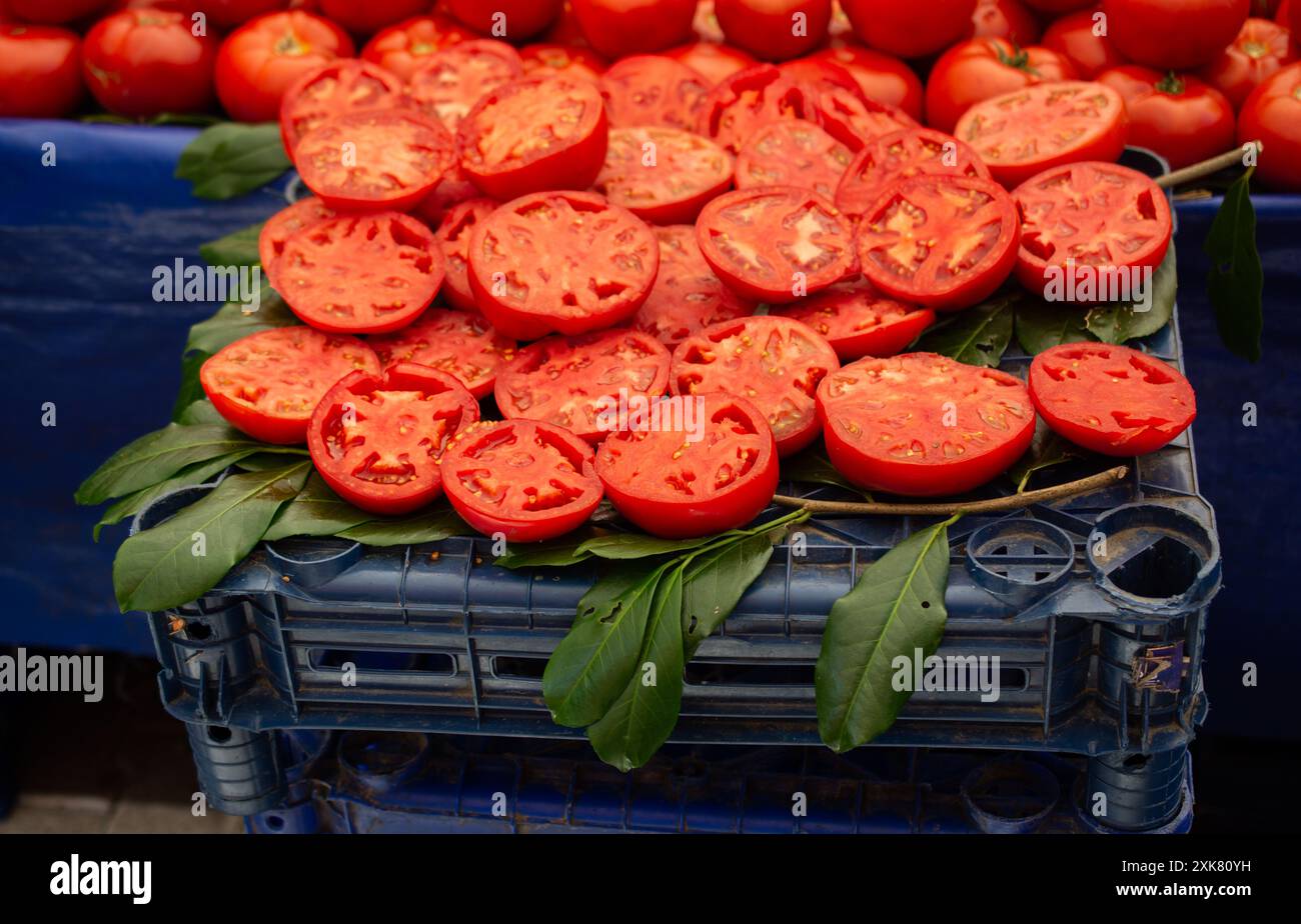 Fresh cut tomato at grocery store for food backgrounds concept Stock ...