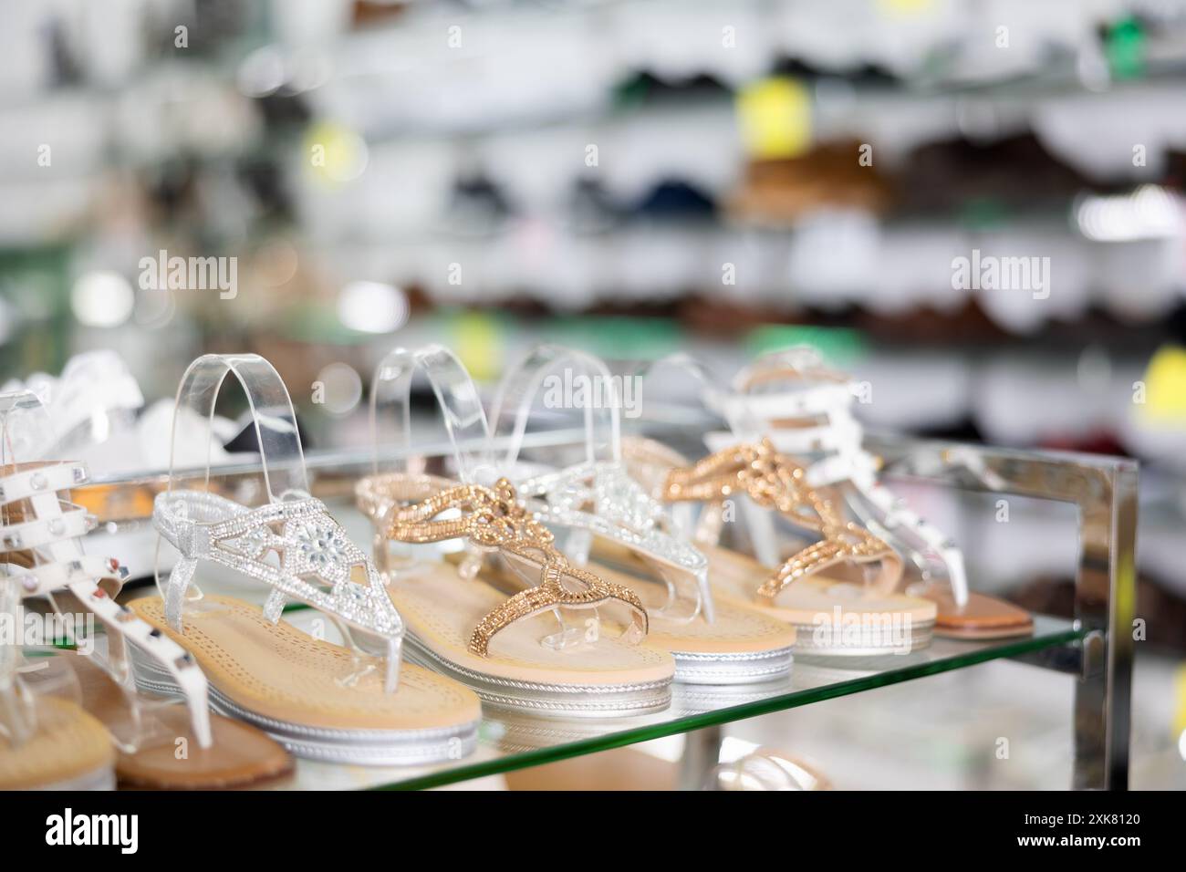 Womens sandals of latest summer collection are presented on glass ...