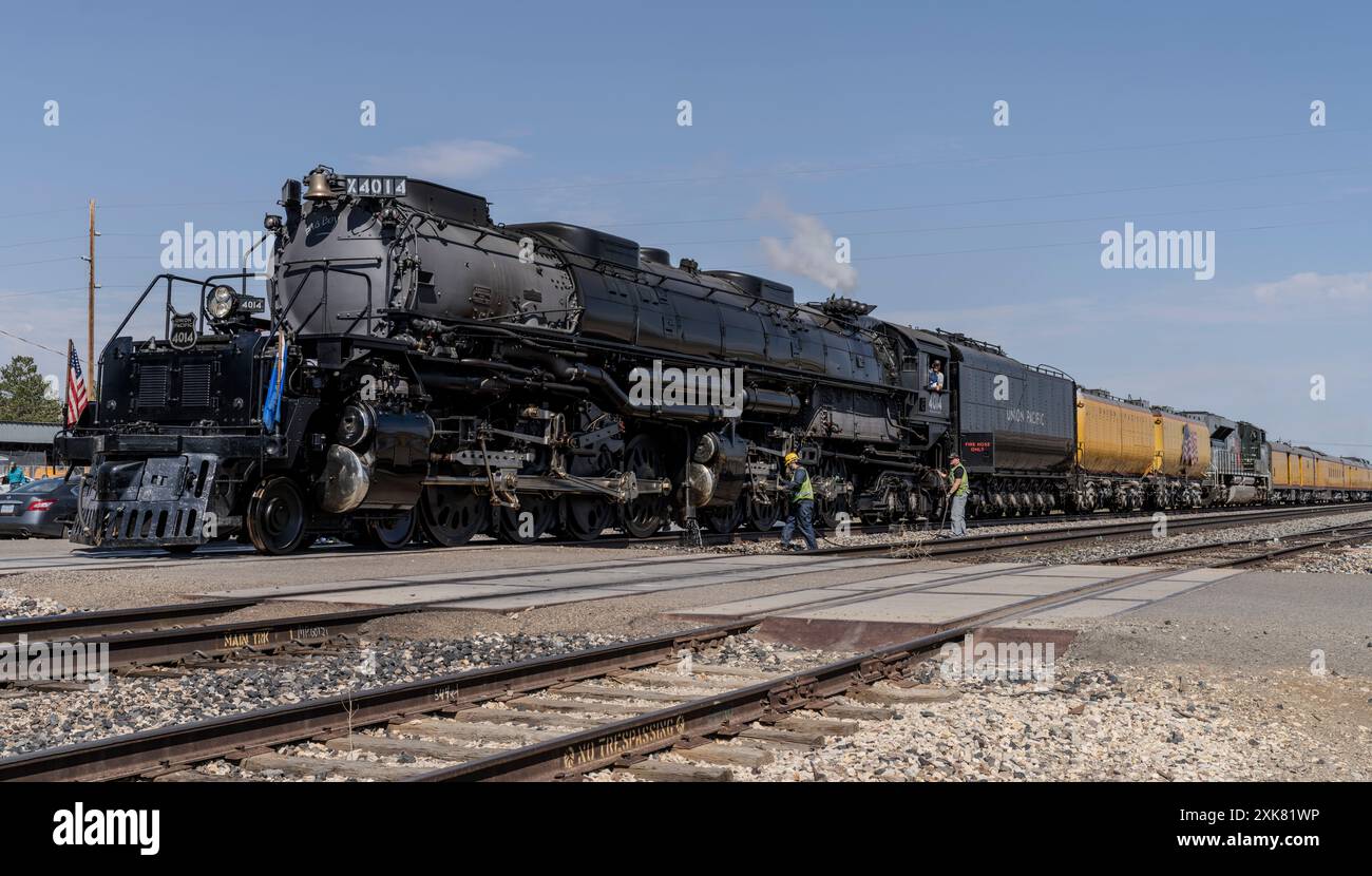 Union Pacific steam locomotive 4014 pauses at a grade crossing in Wells ...