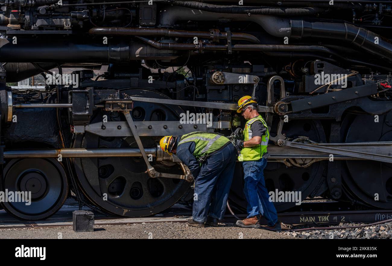 Maintenance workers service Union Pacific steam locomotive 4014 during ...