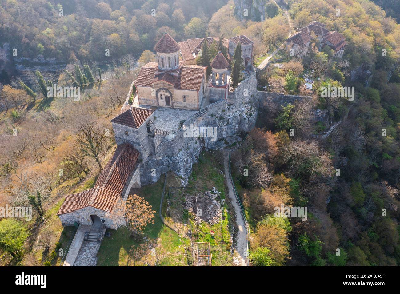 Aerial view of Georgian Orthodox Motsameta monastery on stone cliff ...