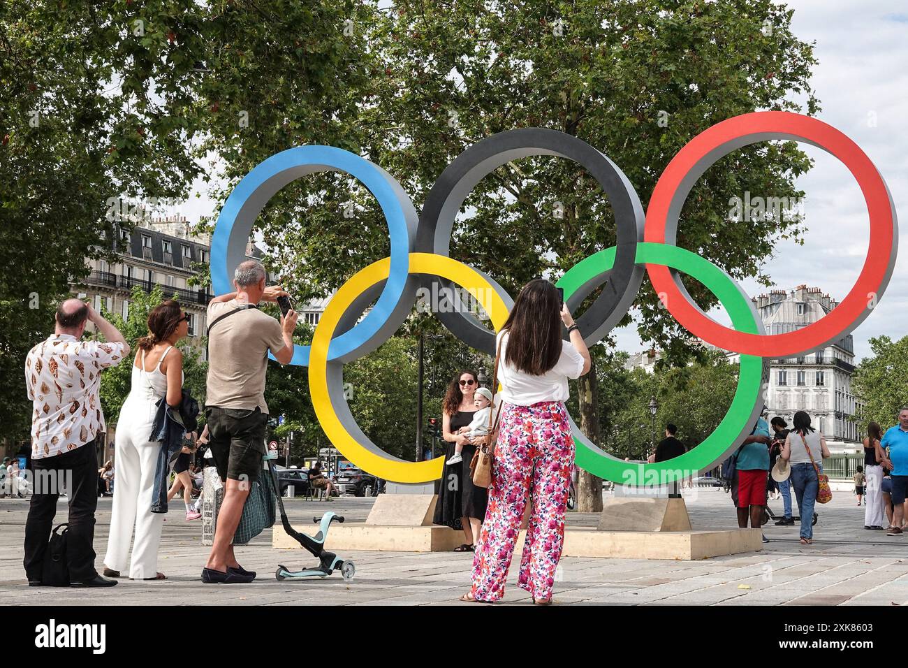 Paris, France. 21st July, 2024. People take photos of the Olympic Rings ...