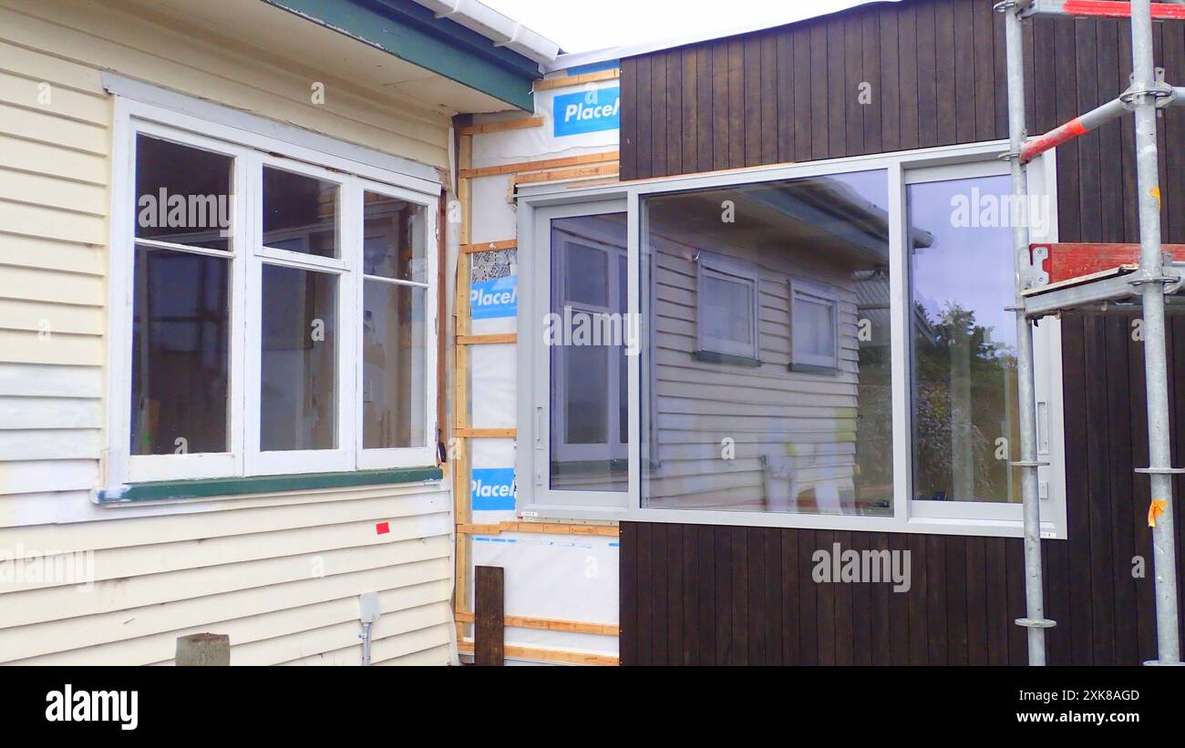 A 1950s Weatherboard House With Original Windows And Cladding With A