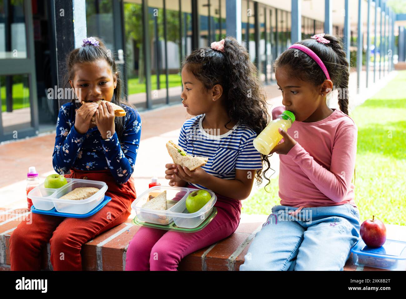 A diverse group of students shares lunch outside Stock Photo - Alamy