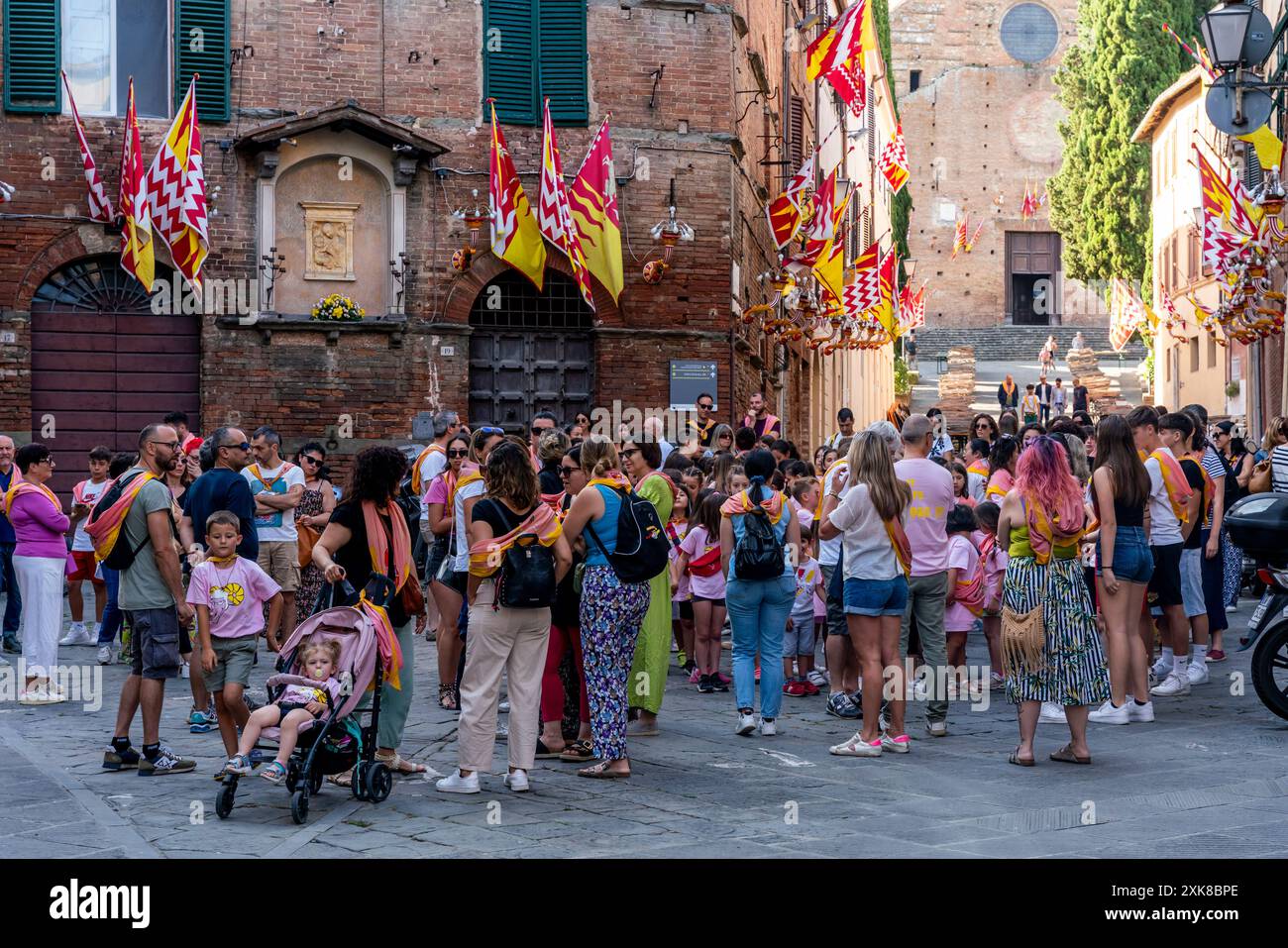People From The Valdimontone (Ram) Contrada Wait To Join A Procession ...