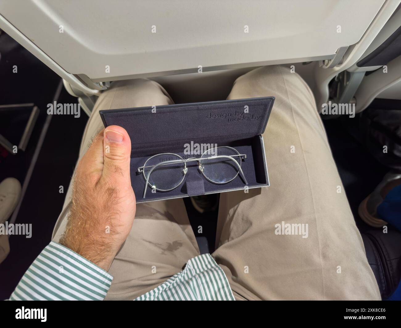 Germany - Jul 11, 2024: A male hand holds luxury LINDBERG titanium ...