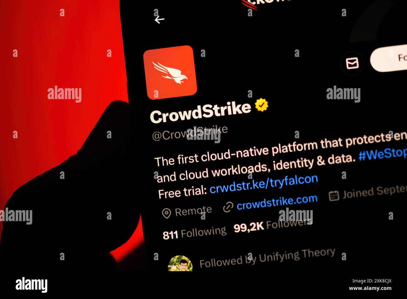 Paris, France - Jul 20, 2024: A male hand holds an iPhone displaying a X Twitter page with ...