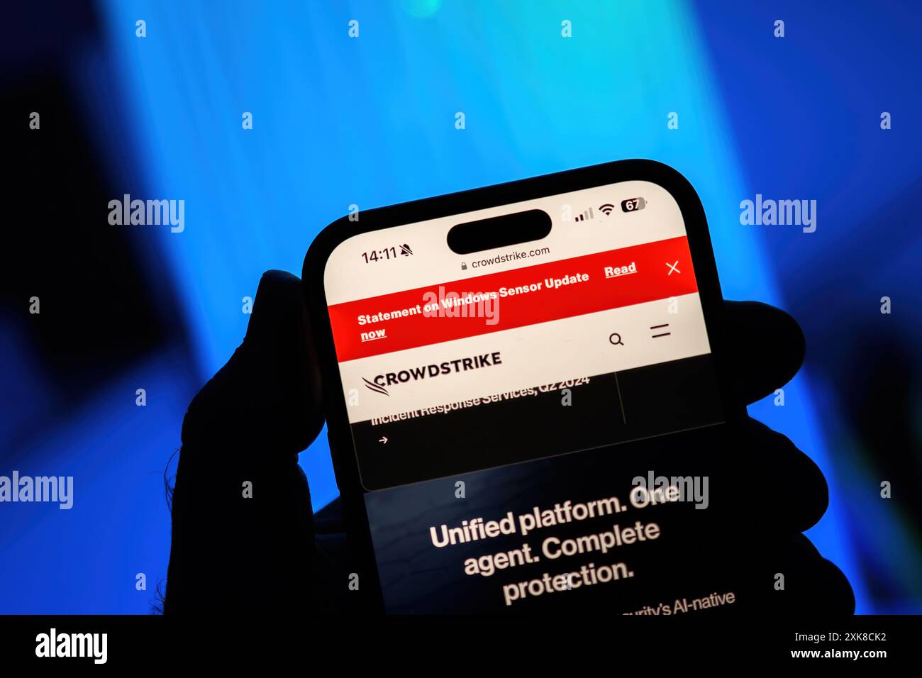 Paris, France - Jul 20, 2024: A male hand holds an iPhone displaying a ...